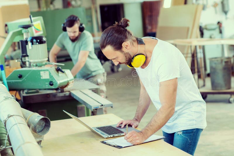 Young Worker in a Carpenter`s Workshop Using Milling Machine Stock ...