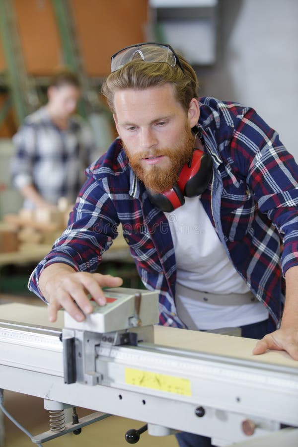 Worker in Carpenters Workshop Using Saw Machine Stock Photo - Image of ...