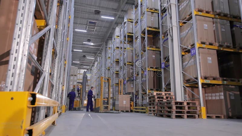 Forklift in the Warehouse Concept. Work in a Modern Warehouse Concept ...