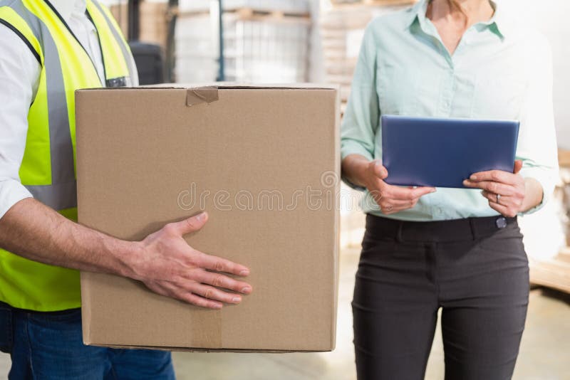 Worker Carrying Box with Manager Holding Tablet Pc Stock Photo - Image ...