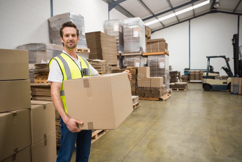 Worker Carrying Box in Warehouse Stock Photo - Image of store, boxes ...