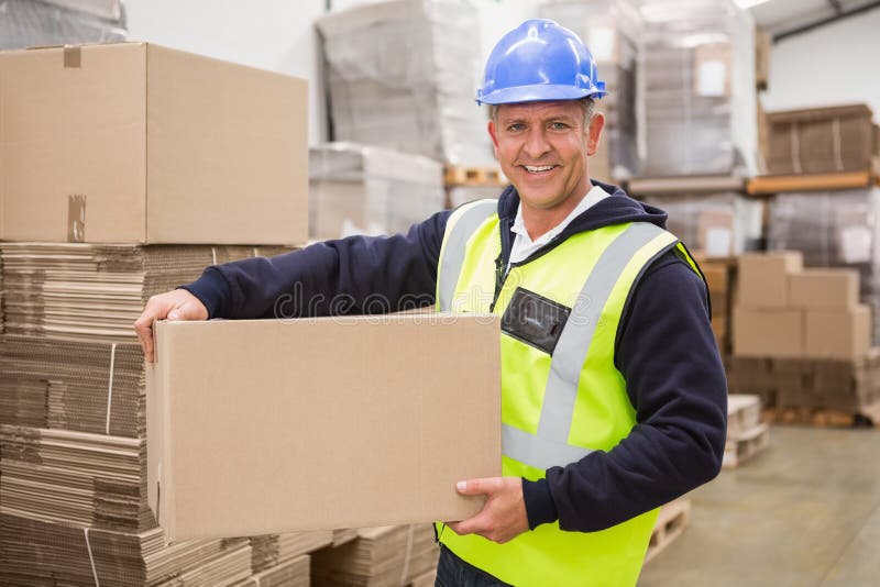 Worker Carrying Box in Warehouse Stock Image - Image of standing ...