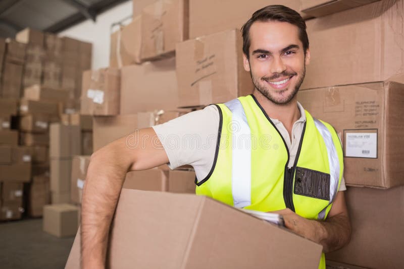 Worker Carrying Box in Warehouse Stock Image - Image of head, shipping ...