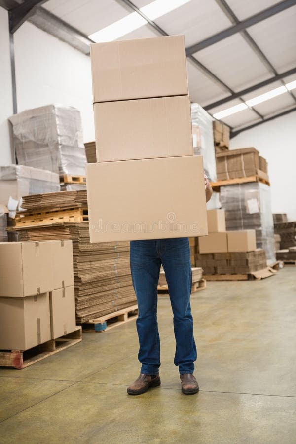 Worker Carrying Boxes in Warehouse Stock Photo - Image of person ...