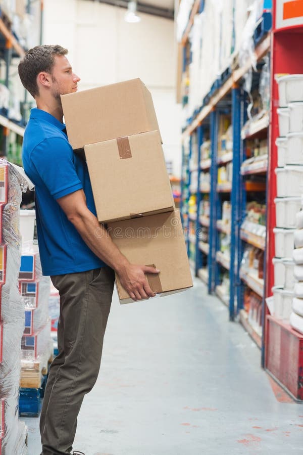Worker Carrying Boxes in Warehouse Stock Photo - Image of person, store ...