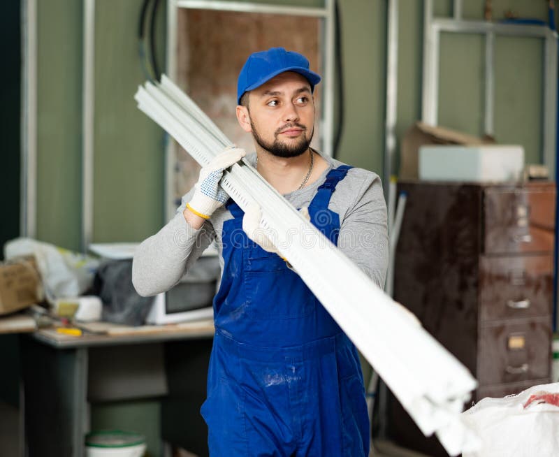 Worker Carrying Construction Materials at Renovating Object Stock Photo ...