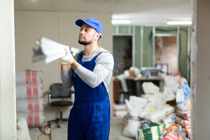 Worker Carrying Construction Materials at Renovating Object Stock Photo ...