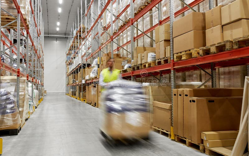 Worker Carrying Loader with Goods at Warehouse Stock Image - Image of ...