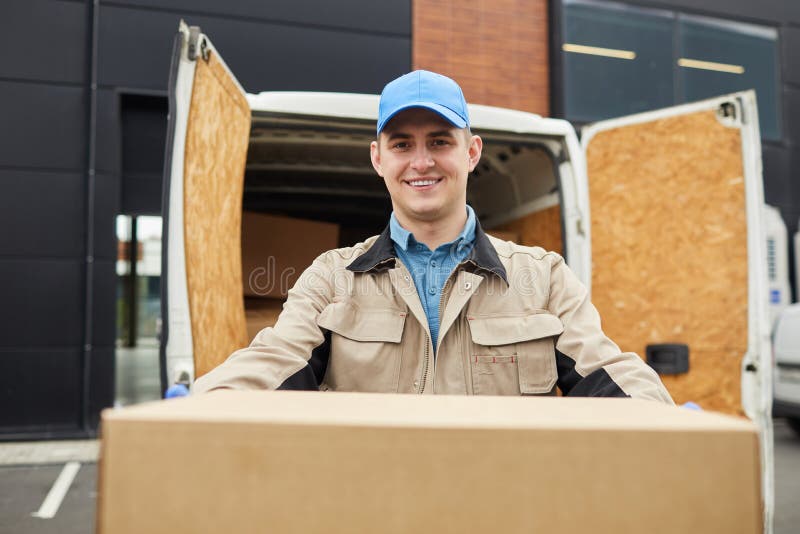 Worker carrying the loads stock photo. Image of holding - 189105672