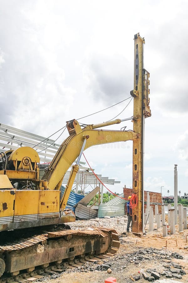 Worker Carrying Out Ground Piling Work at Construction Site Stock Photo ...