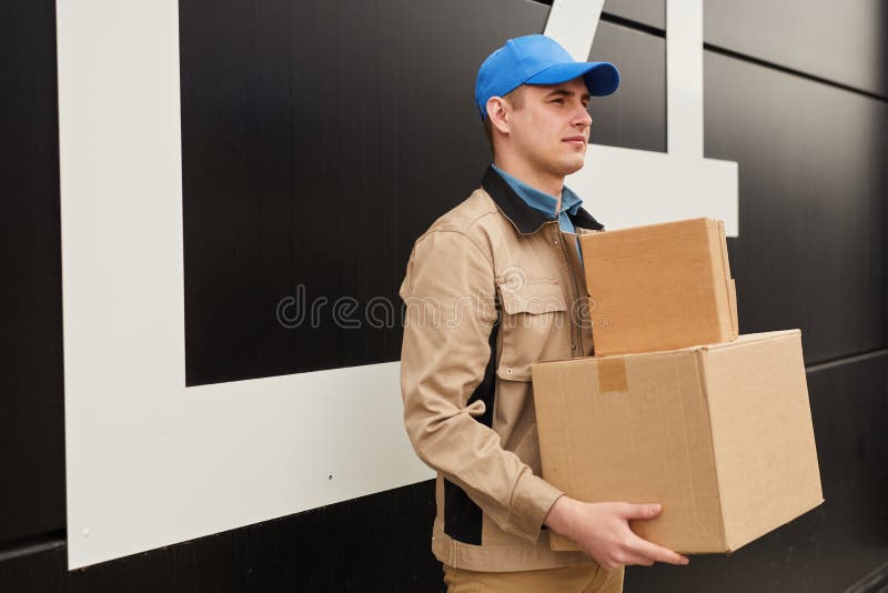 Worker Carrying Box in Warehouse Stock Photo - Image of delivery ...