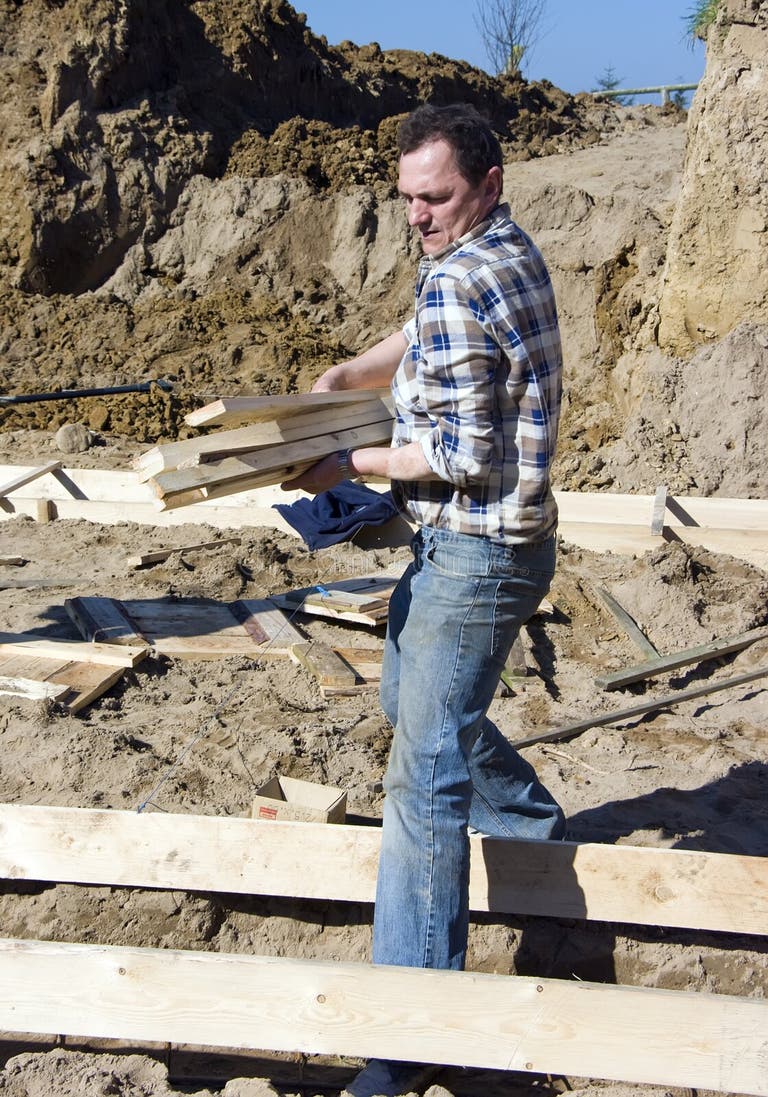 Contractor Carrying Lumber Stock Photos - Free & Royalty-Free Stock ...