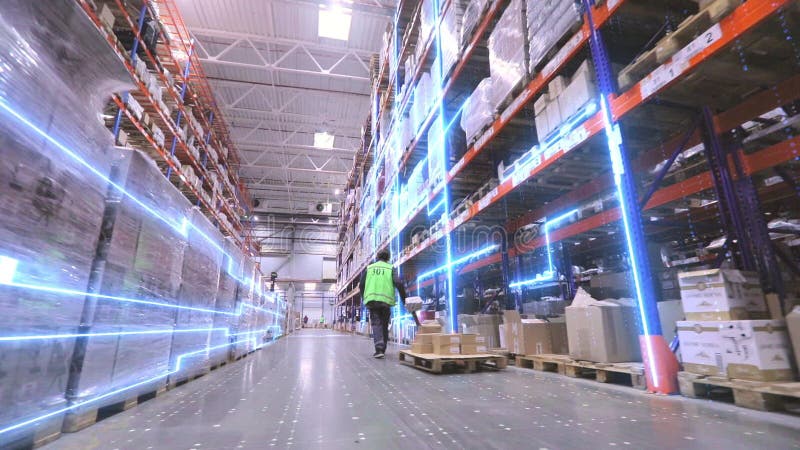 A Worker is Carrying a Rokla through a Large Warehouse. the Worker ... A Worker is Carrying a Rokla through a Large Warehouse. the Worker ...
