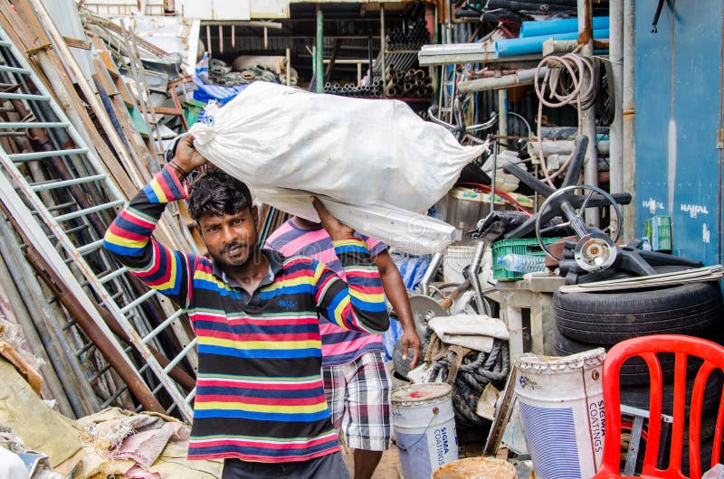 Worker carrying a sack editorial image. Image of worker - 63440020