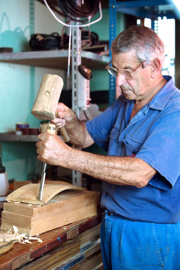 Worker Carving Wood with a Chisel and Hammer Stock Image - Image of ...