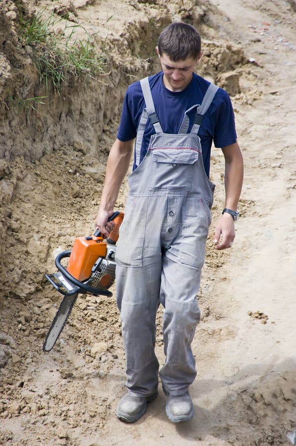 Worker with chainsaw stock photo. Image of carries, adult - 5465418