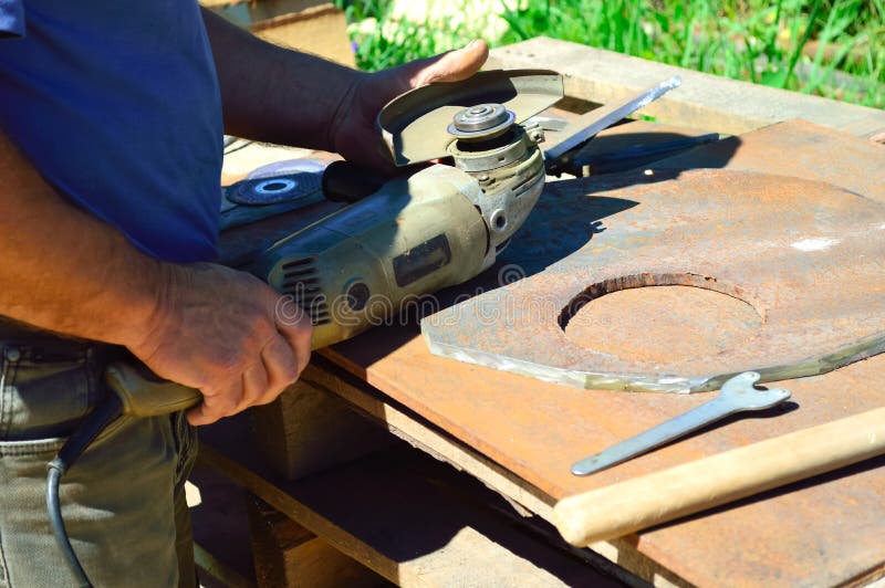 A Worker Changes a Grinding Disc that Wasted during Metal Cutting Stock ...