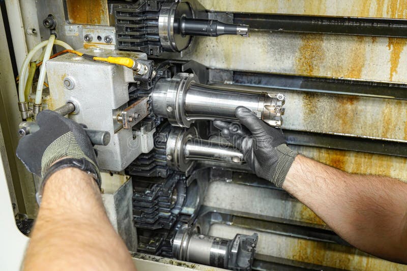 A Worker Changes a High-speed Cutter on a CNC Milling Machine Stock ...