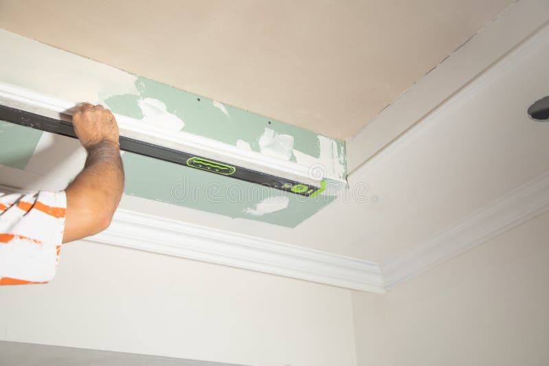 Worker Checking Ceiling with a Spirit Level at Home Stock Image - Image ...