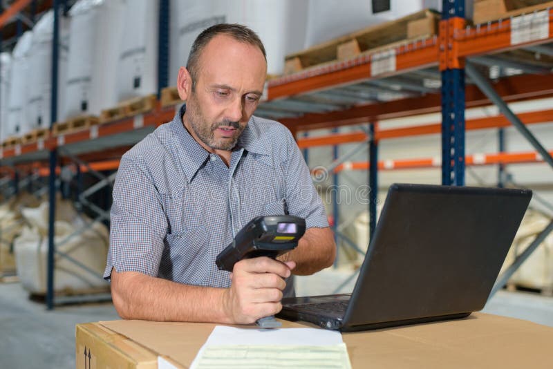 Worker Checking Goods with Barcode Scanner Stock Photo - Image of ...