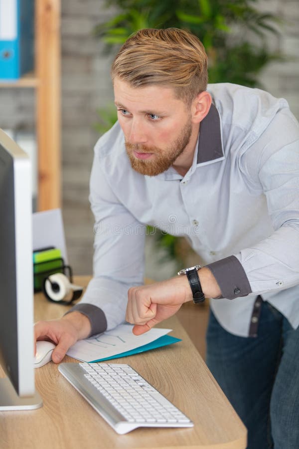 Worker Checking and Looking at Wrist Watch Stock Photo - Image of ...