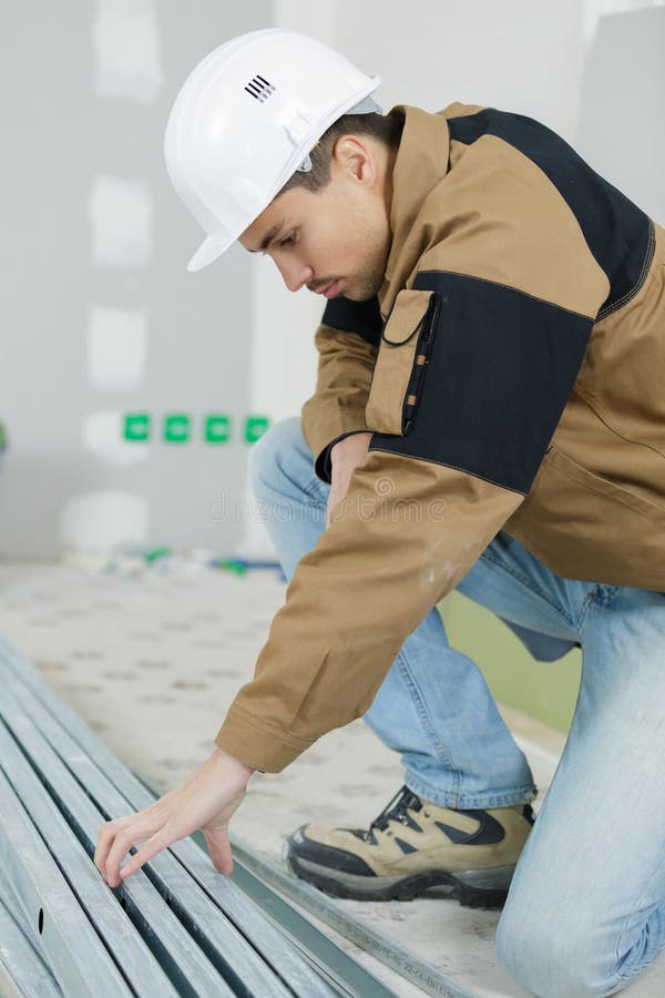 Worker Checking Metal Pipe in Front Building Stock Photo - Image of ...