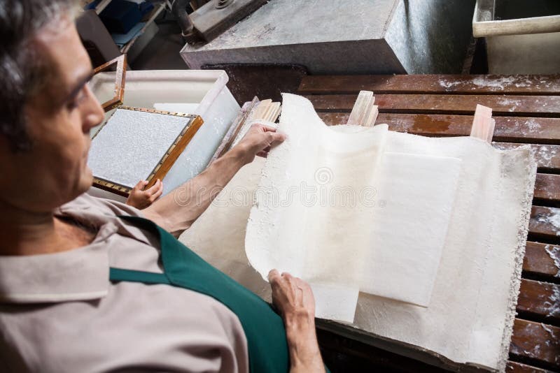 Worker Checking Paper Sheets at Table in Factory Stock Photo - Image of ...