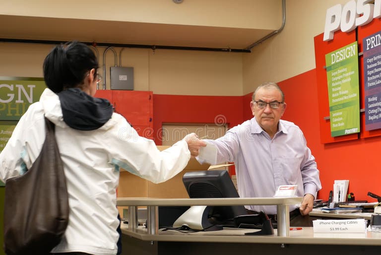 Worker Checking Parcel for Customer at Post Office Editorial Image ...