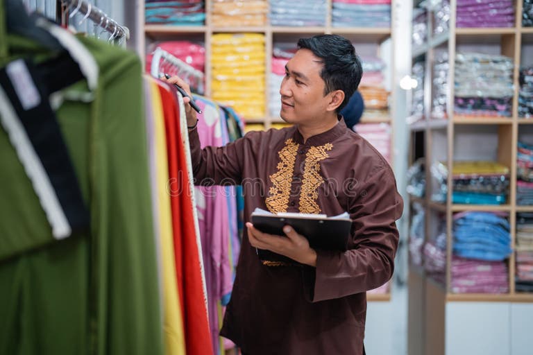 Worker Checking the Product of His Shop Holding a Note Stock Image ...