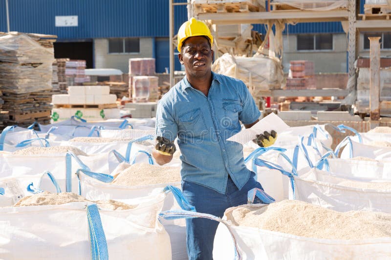 Worker Checking Quality of Building Mix at Hardware Store Stock Image ...