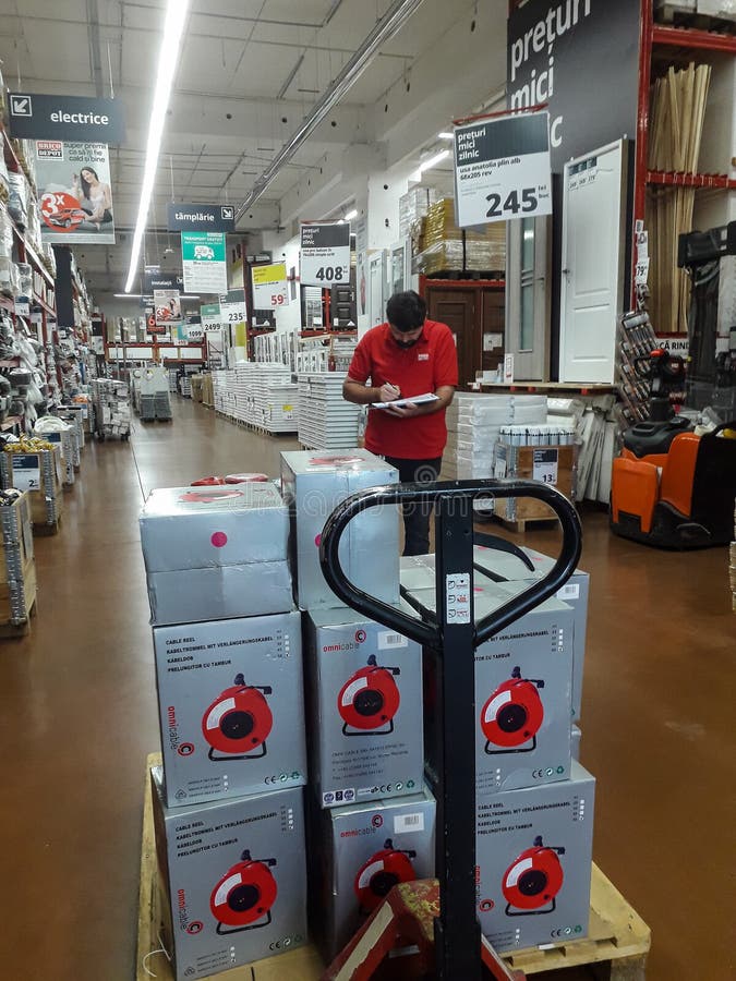 Worker Checking Some Papers on an Aisle in De Department Store in ...