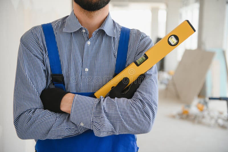 Worker Checking Vertical Level with Bubble Level Tool Stock Photo ...