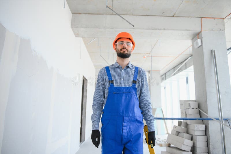 Worker Checking Vertical Level with Bubble Level Tool Stock Photo ...