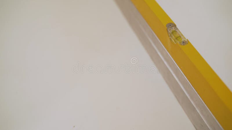 Smooth White Floor Test Tool. a Worker Checks the Floor Level Using a ...