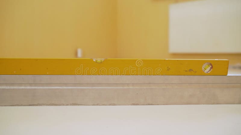 Smooth White Floor Test Tool. a Worker Checks the Floor Level Using a ...