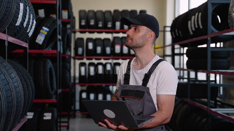 Worker Checks the Number of Tires in a Warehouse Stock Footage - Video ... Worker Checks the Number of Tires in a Warehouse Stock Footage - Video ...
