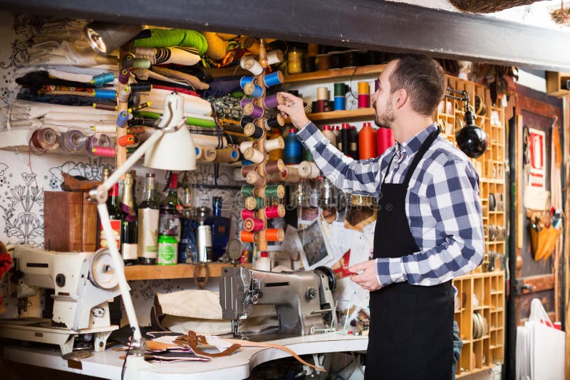Worker Choosing Thread for Sewing Stock Image - Image of instrument ...