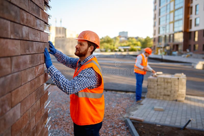 Worker Cladding Stone for External Wall Warming Stock Photo - Image of ...