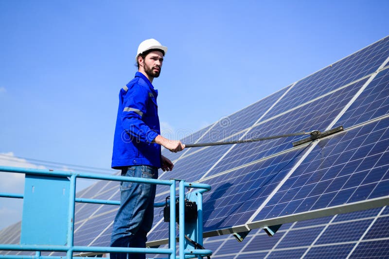 Worker Cleaning Solar Panel at Solar Cell Farm Stock Image - Image of ...