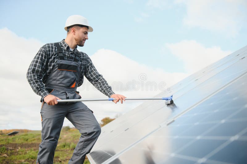 Worker Cleaning Solar Panels after Installation Outdoors Stock Image ...