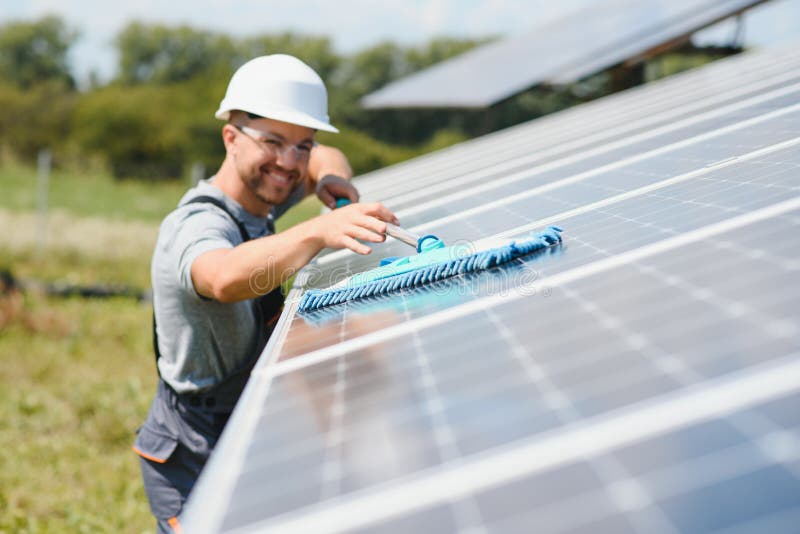 Worker Cleaning Solar Panels after Installation Outdoors Stock Photo ...