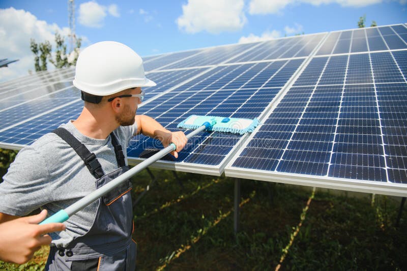 Worker Cleaning Solar Panels after Installation Outdoors Stock Photo ...