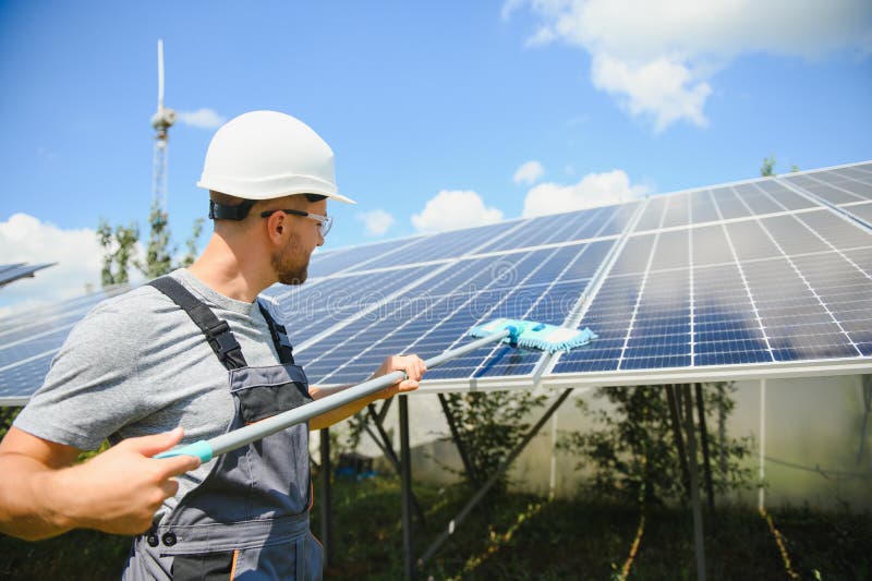 Worker Cleaning Solar Panels after Installation Outdoors Stock Image ...