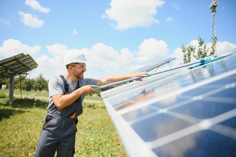 Worker Cleaning Solar Panels after Installation Outdoors Stock Image ...