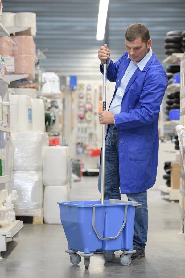 Worker Cleaning Store Floor Stock Image - Image of cleaning, caucasian ...