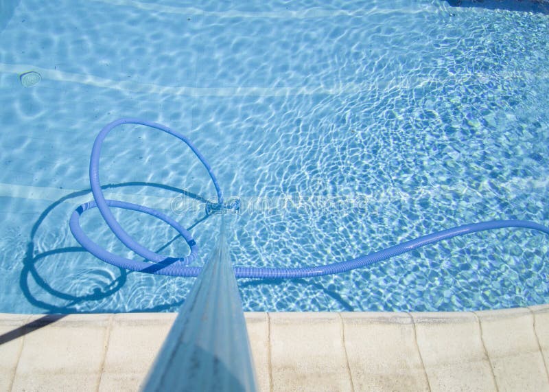 Worker Cleaning and Vacuuming the Bottom of the Pool Stock Photo ...