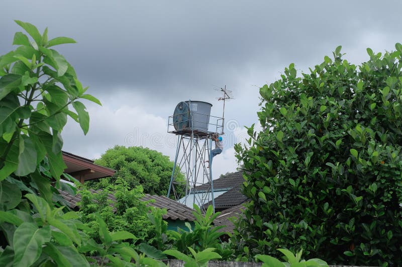 Worker Cleaning in Water Tank on the Tower. Water Storage Stock Photo ...