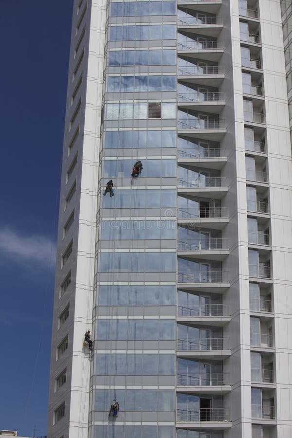 Cleaning Skyscrapers Outside with a Crane - Window Washing Stock Image ...