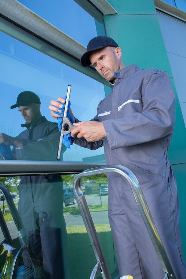 Worker Cleaning Windows Service on High Rise Building Stock Image ...