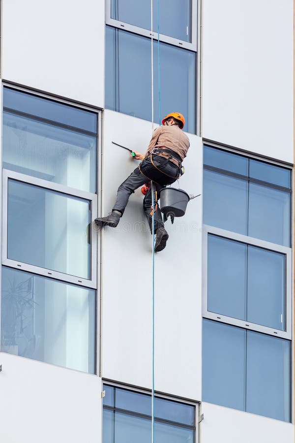 The Worker Cleaning Windows Service on High Rise Editorial Stock Image ...